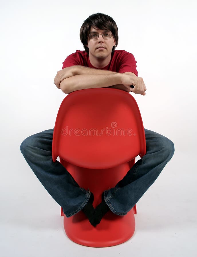 Man on a chair stock photo. Image of jeans, chair, glasses - 1751052