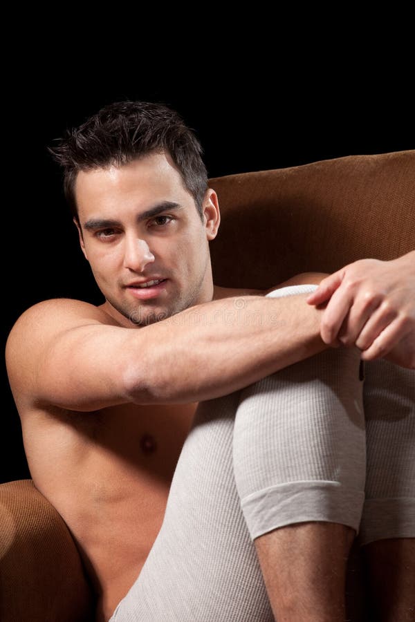 Man in Chair stock image. Image of underwear, adult, young - 18249169