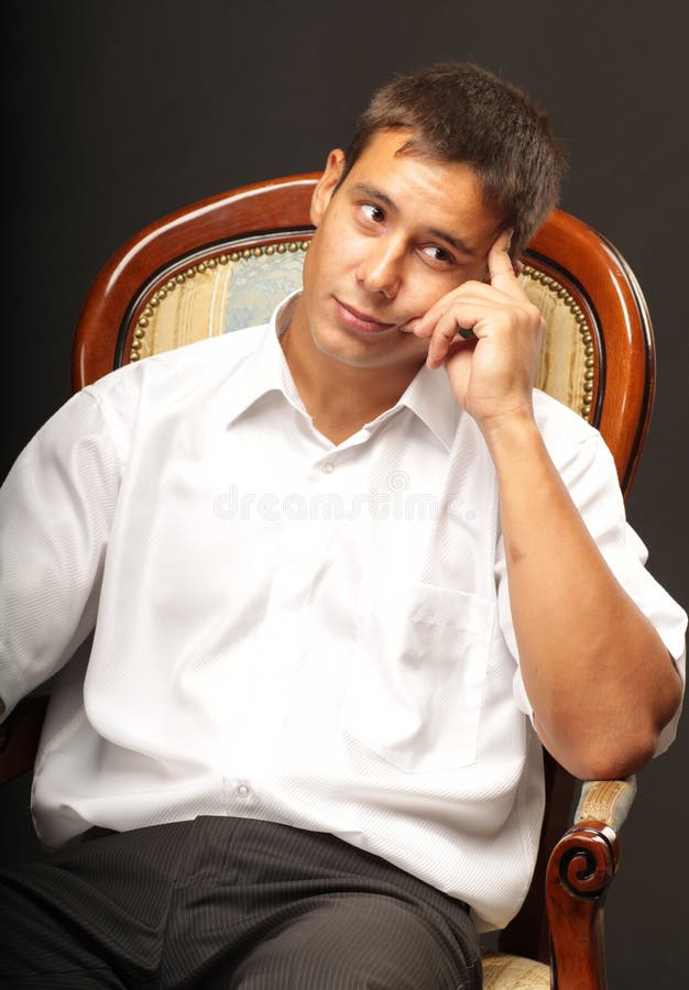 A man and a chair. stock image. Image of concept, brunette - 20456663