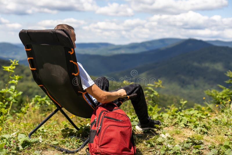 A Man on a Chair in the Mountains Stock Image - Image of hiking ...