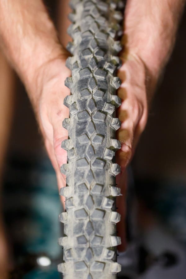 A Man Changes the Camera on a Bicycle Wheel. Spike Bike Chamber Stock ...