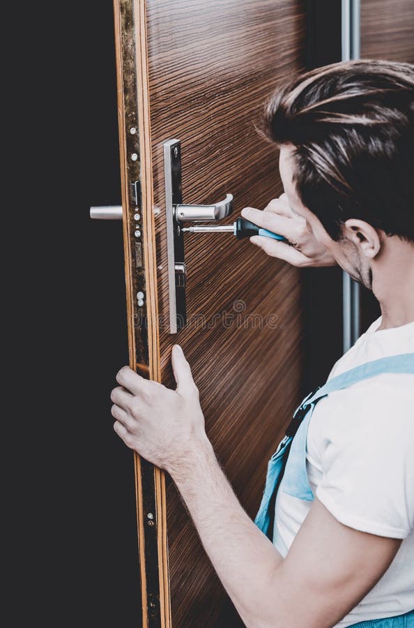 Man Changes the Lock in the Door Stock Photo - Image of wooden, fixing ...