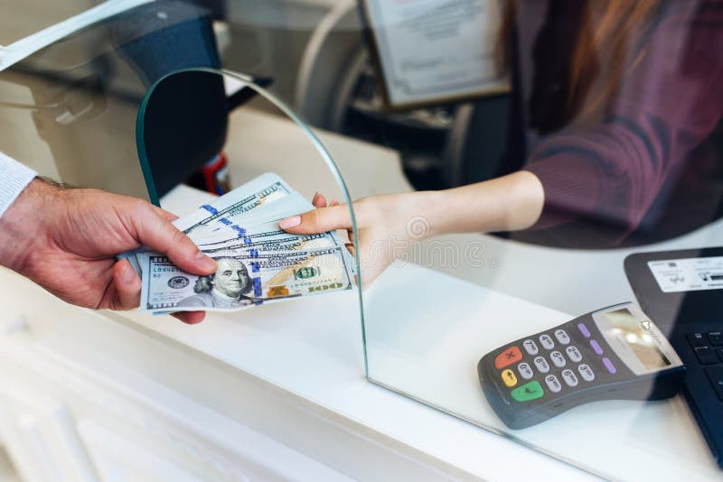 Man Changes Money in a Currency Exchange, a Large Sum of Dollars, an ...