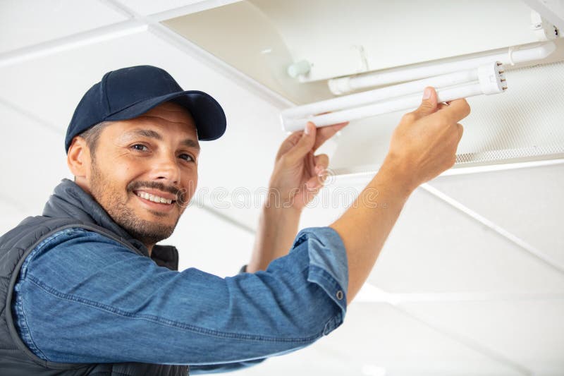 Man Changes Neon Light Bulb Stock Photos - Free & Royalty-Free Stock ...