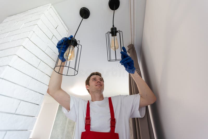 Man Changing Led Ceiling Lamp in New House Stock Image - Image of ...