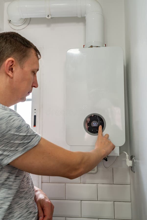 Man Changing Temperature Gas Boiler Stock Photos - Free & Royalty-Free ...