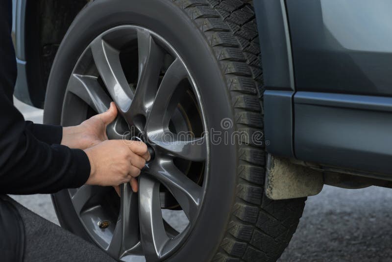Man Changing Car Tire Near Road, Focus on Emergency Warning Triangle ...