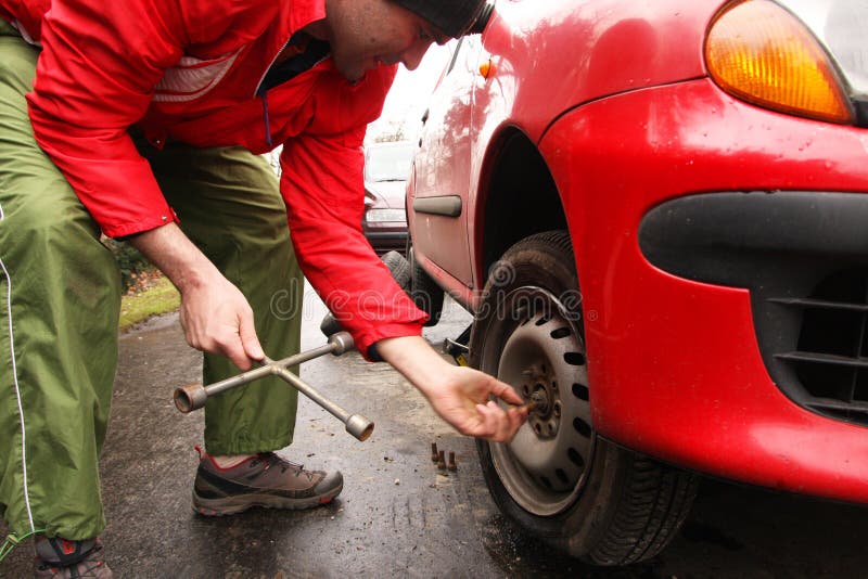 Man Changing A Tire On The Street Stock Image - Image of tire, person ...