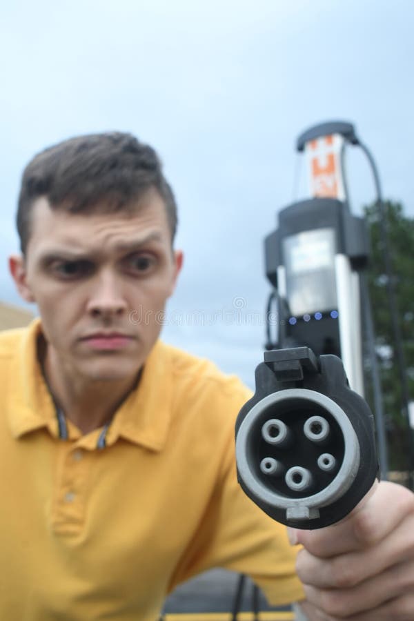 Man Charging His Electric Vehicle Stock Image - Image of volts, charge ...