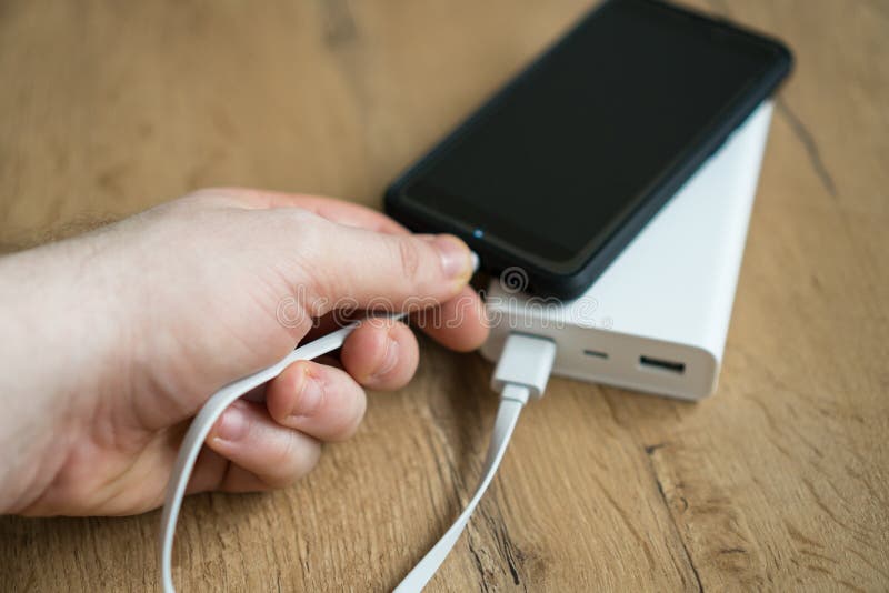 Man charging smartphone. stock image. Image of bank - 112062807
