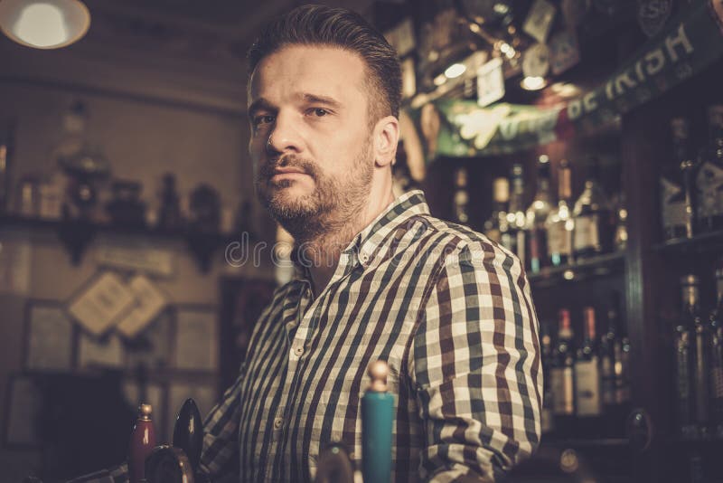 Man Chatting with a Bartender in a Pub Stock Image - Image of alone ...