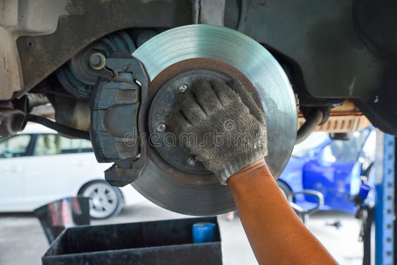 Man check the car brake. stock photo. Image of work, control - 96679158