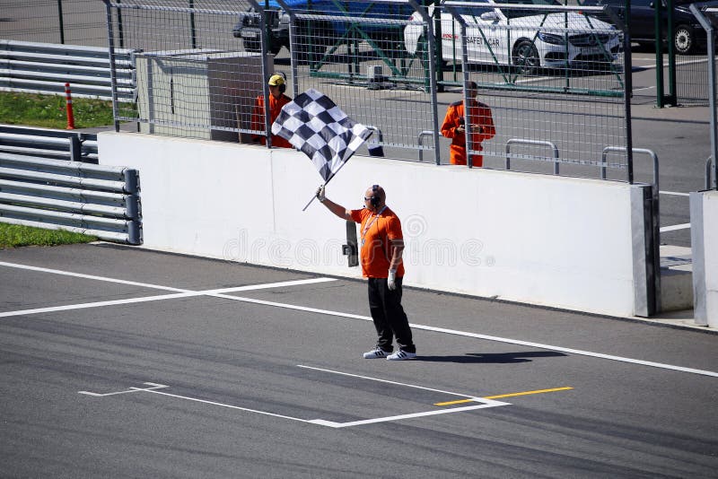 Man Waving A Checkered Flag On A Raceway Stock Photo - Image of finish ...