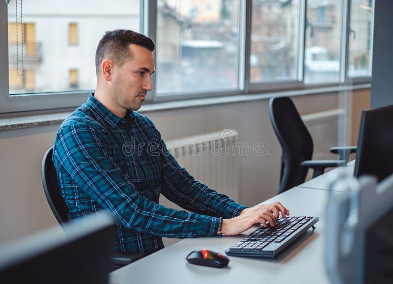 Man Typing on Desktop Computer in the Office Stock Image - Image of ...