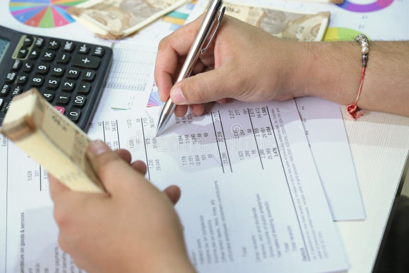 Man is Checking Account with Holding Indian Currency Notes in Hand ...