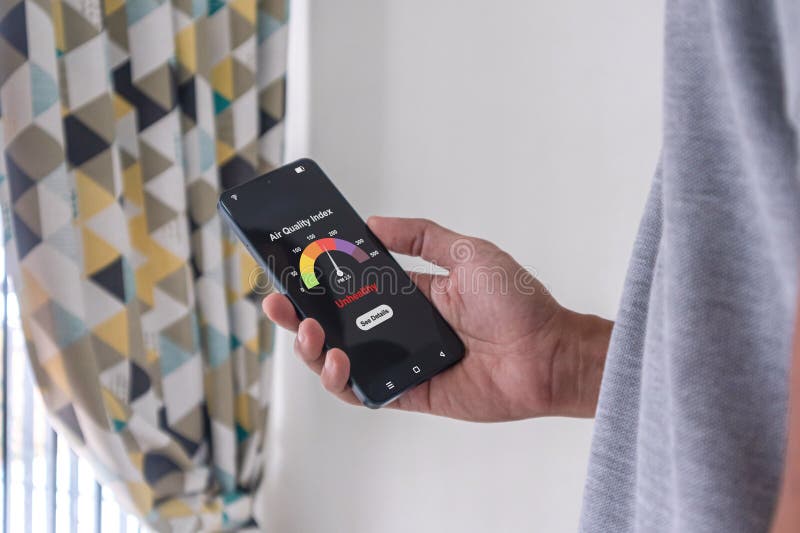 Man Checking Air Quality Index Using an App on His Smartphone Stock ...