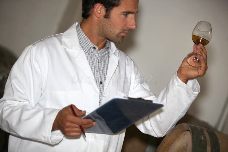 Man checking brandy stock photo. Image of analysis, holding - 33514590