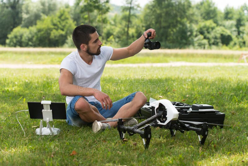 Man Checking the Camera from a Drone Stock Image - Image of battery ...