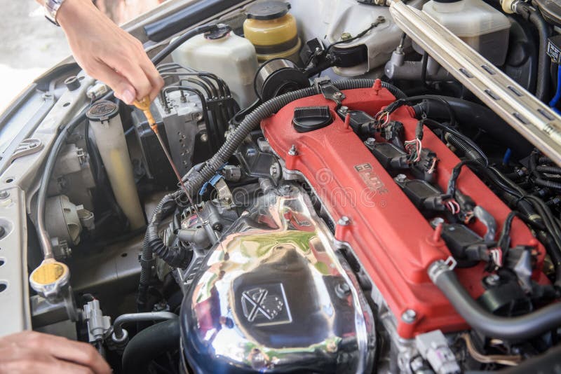A man checking car engine stock image. Image of hand - 253382627