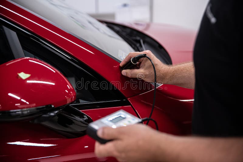 Man Mechanic Checking Car Paint Thickness with Electronic Meter Stock ...