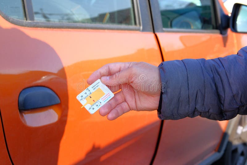 Man is Checking Car Tire Tread Depth with Caliber. Tread Depth Meter at ... Man is Checking Car Tire Tread Depth with Caliber. Tread Depth Meter at ...