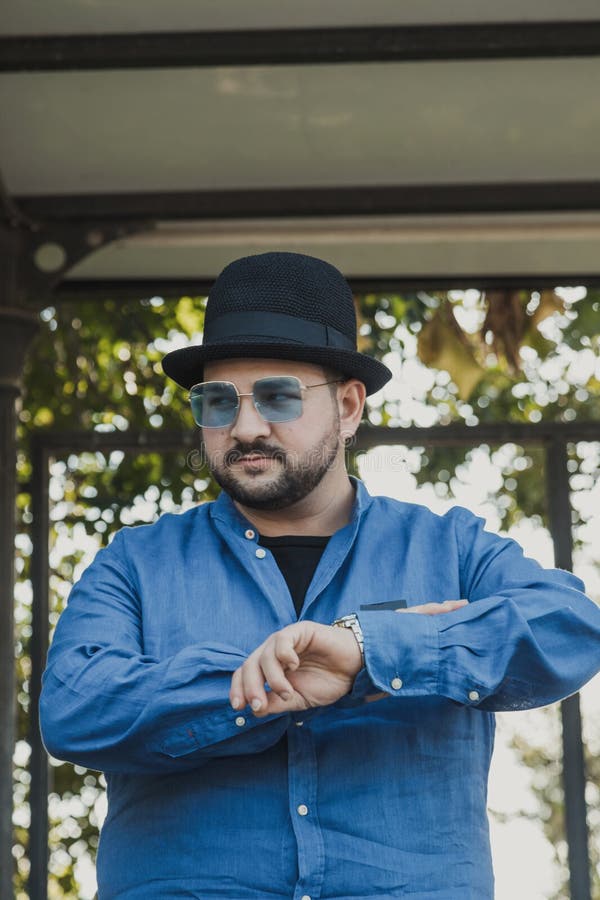 Man Checking the Clock while Waiting at the Station Stock Image - Image ...
