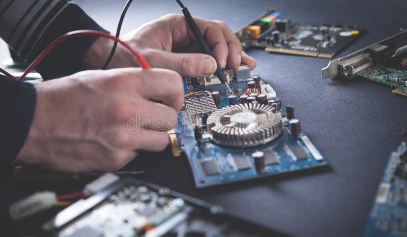 Man Checking Computer Motherboard With A Multimeter Stock Photo - Image ...