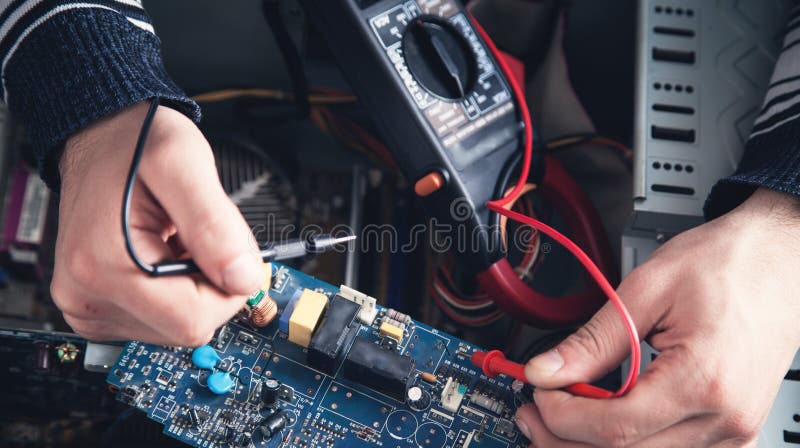 Man Checking Computer with a Multimeter Stock Image - Image of check ...