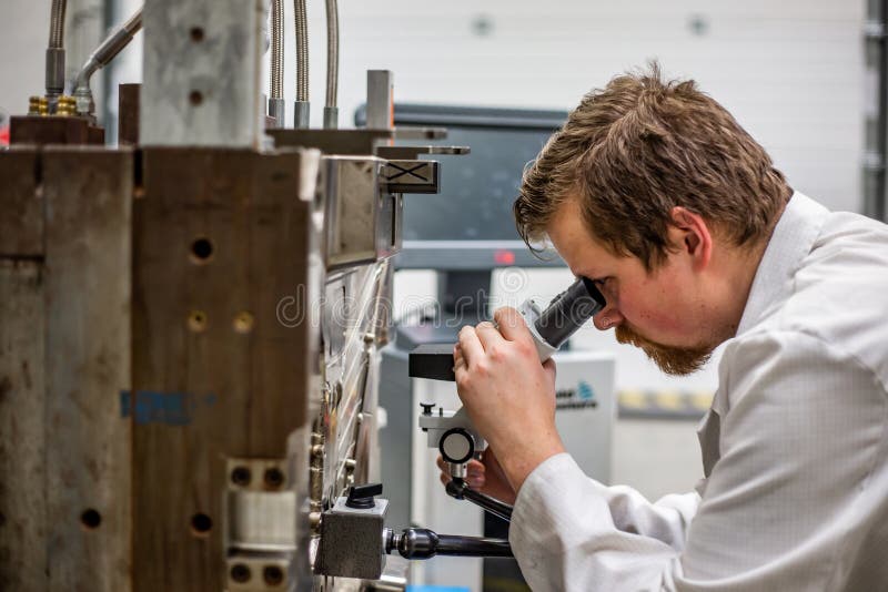Man Checking or Doing Maintenance the Plastic Injection Mold for ...