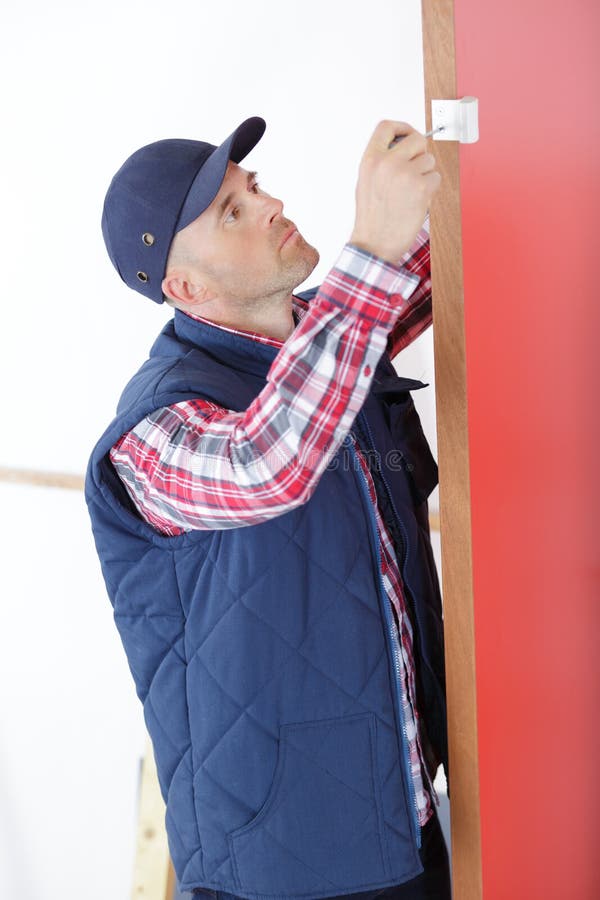 Man checking the door stock image. Image of door, vocational - 123024693