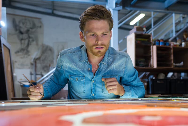 Man Checking Drawings in Workshop Stock Image - Image of hipster, male ...