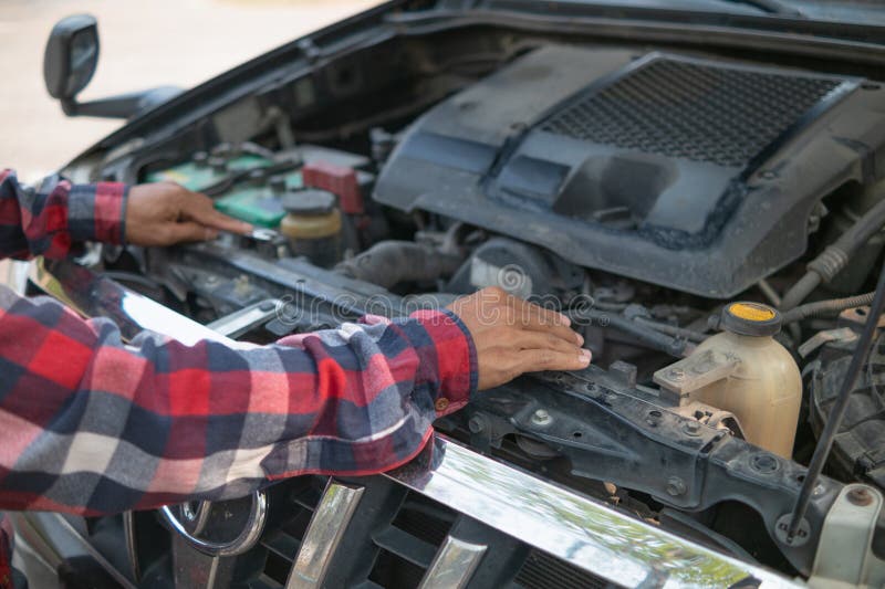 The Man is Checking the Engine and Condition of Car To Fix it Properly ...