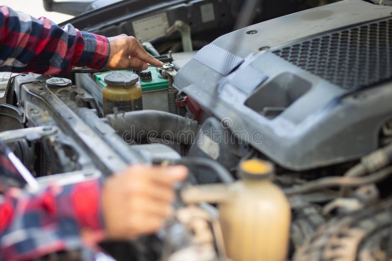 The Man is Checking the Engine and Condition of Car To Fix it Properly ...