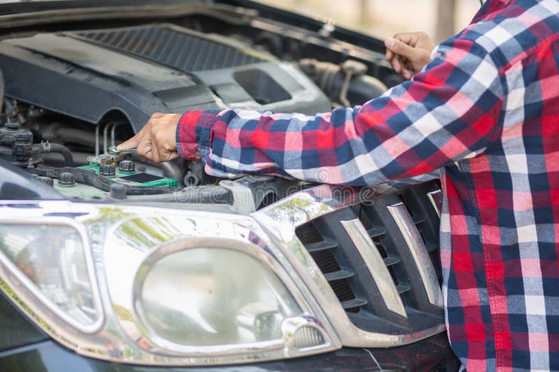 The Man is Checking the Engine and Condition of Car To Fix it Properly ...