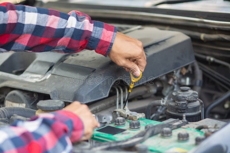 The Man is Checking the Engine and Condition of Car To Fix it Properly ...