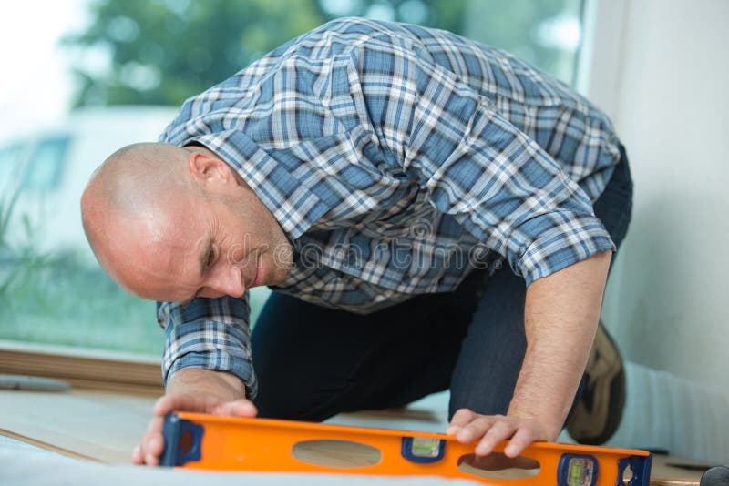 Man Checking Flooring Level Stock Image - Image of renovation, bubble ...