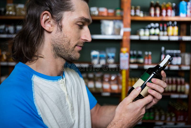 Man Checking Grocery Items in Supermarket Stock Image - Image of ...