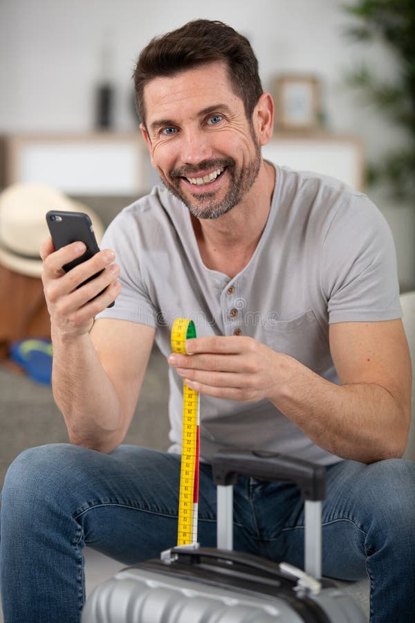 Man Checking Hand Luggage Measurements Stock Photo - Image of balance ...