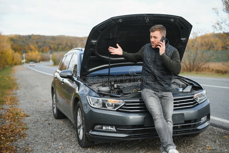 Man Checking His Broke Down Car Stock Photo - Image of driver, hood ...
