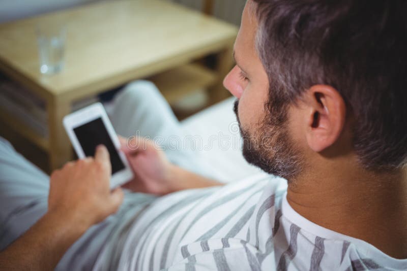 Man Checking His Mobile Phone Stock Photo - Image of abode, indoors ...