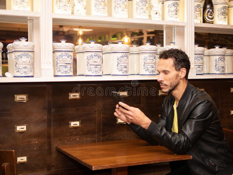 Man Checking His Smart Phone Stock Image - Image of male, alone: 165034095