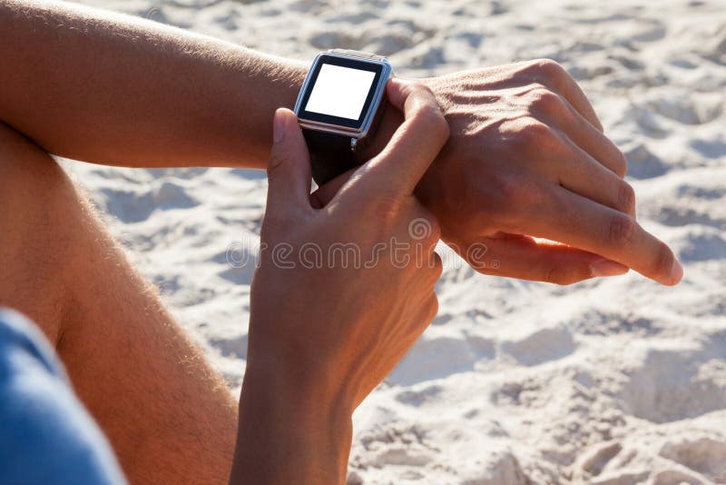 Man Checking His Smartwatch on the Beach Stock Photo - Image of device ...
