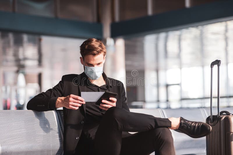 Man Checking His Ticket before the Departure Stock Photo - Image of ...