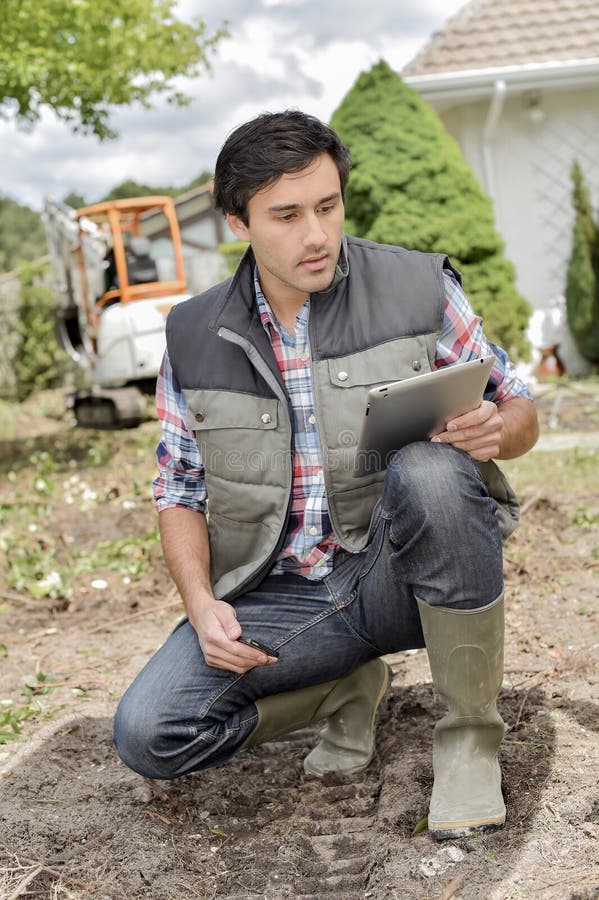 Man Checking for Instructions Stock Photo - Image of vocation, young ...