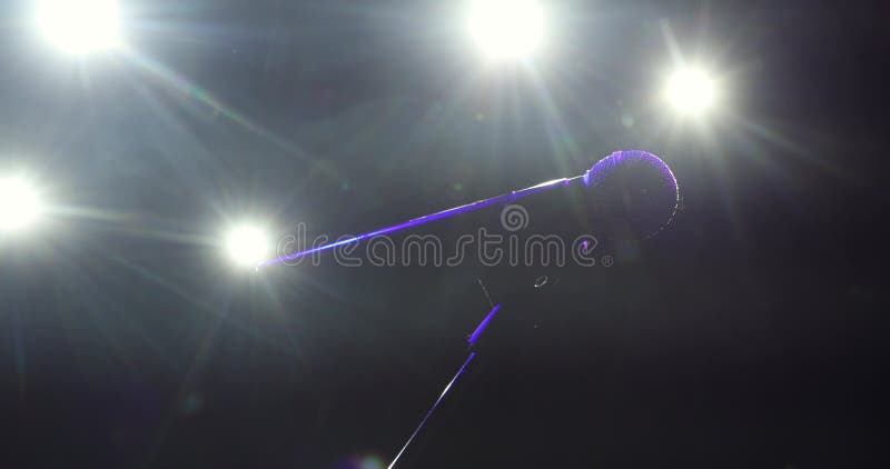 Hand of Man Testing Microphone on Stage in Spotlight Preparing To ...