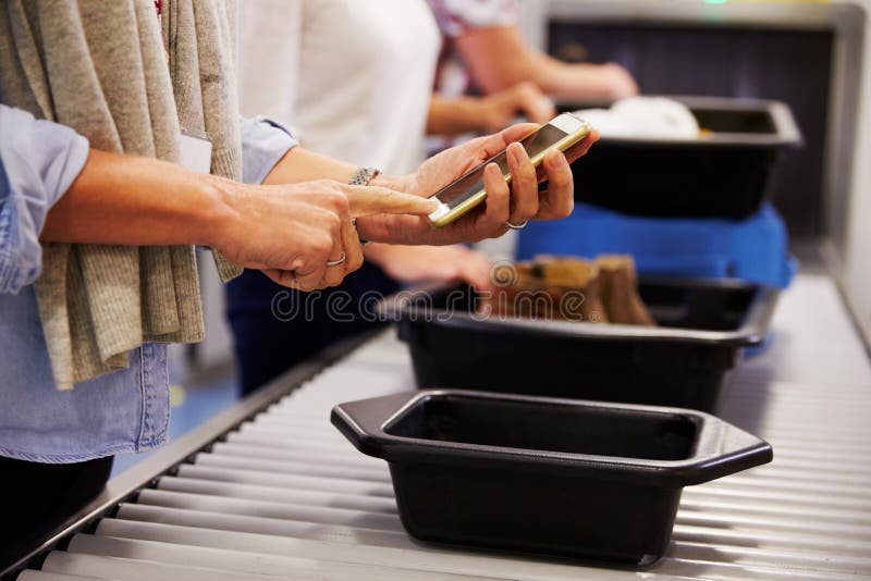 Man Checking Mobile is Charged at Airport Security Check Stock Photo ...