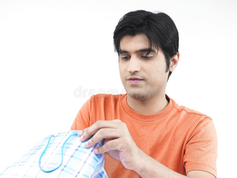 Man checking out his bag stock image. Image of attractive - 7320139