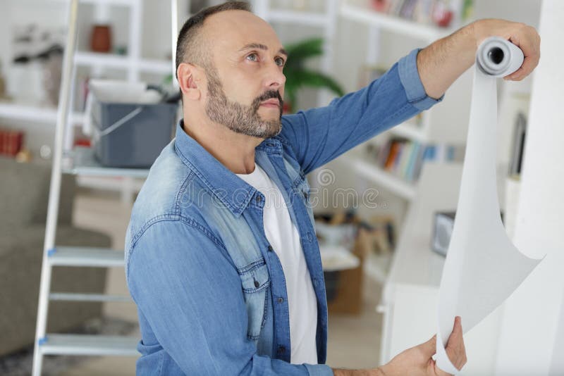 Man checking paper wall stock photo. Image of interior - 197409882