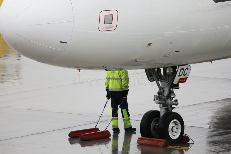 Man Checking Plane on Apron Editorial Stock Image - Image of checking ...