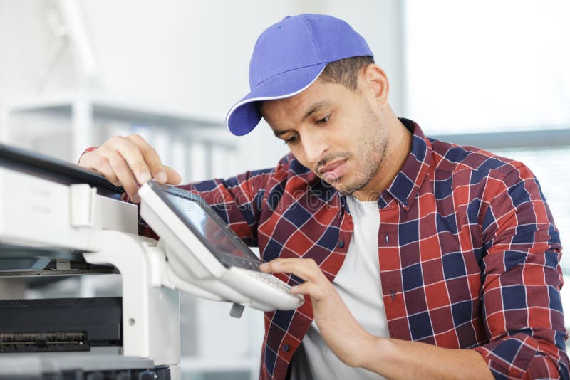 Man checking printer stock image. Image of confident - 260340879